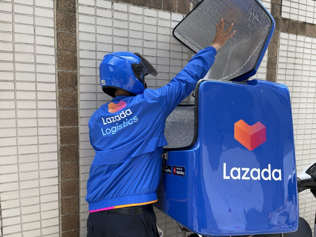 5. Rider with the new blue of Lazada Logistics reflects efficiency and ...